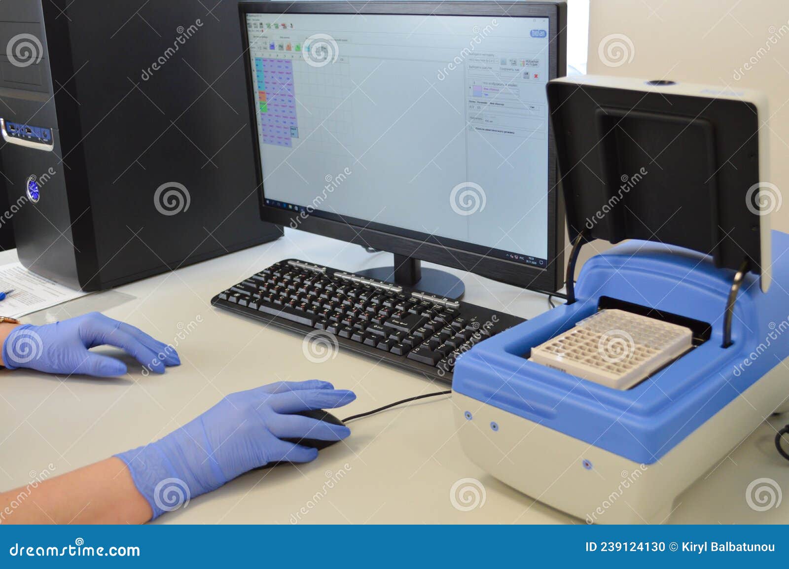 GP Doctor Working With Computer In Medical Office. Male General ...