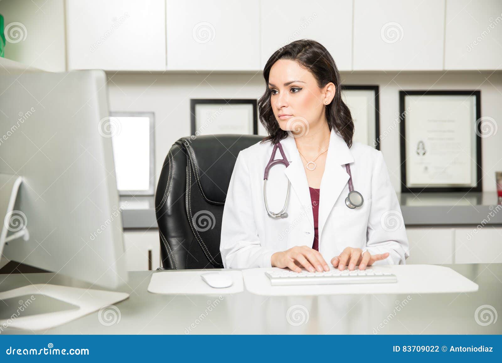 Female Doctor Working in Her Office Stock Photo - Image of stethoscope ...