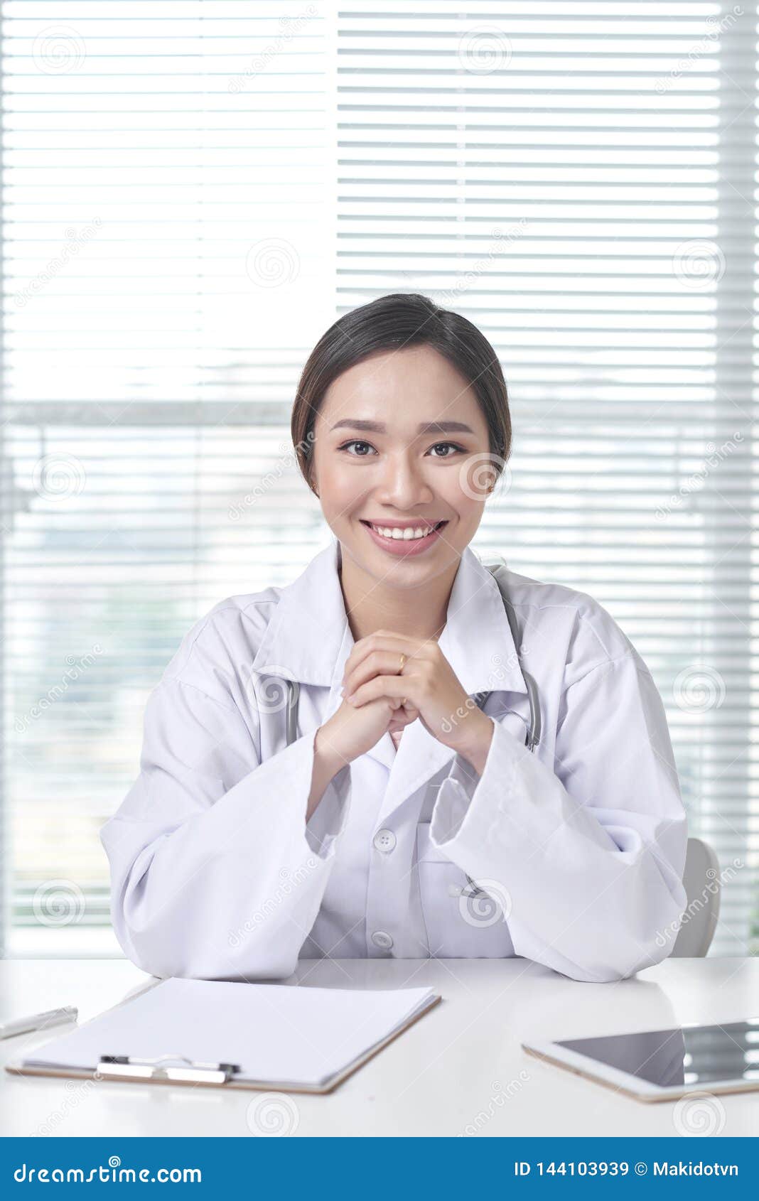 Female Doctor Working at Office Desk and Smiling at Camera Stock Image ...