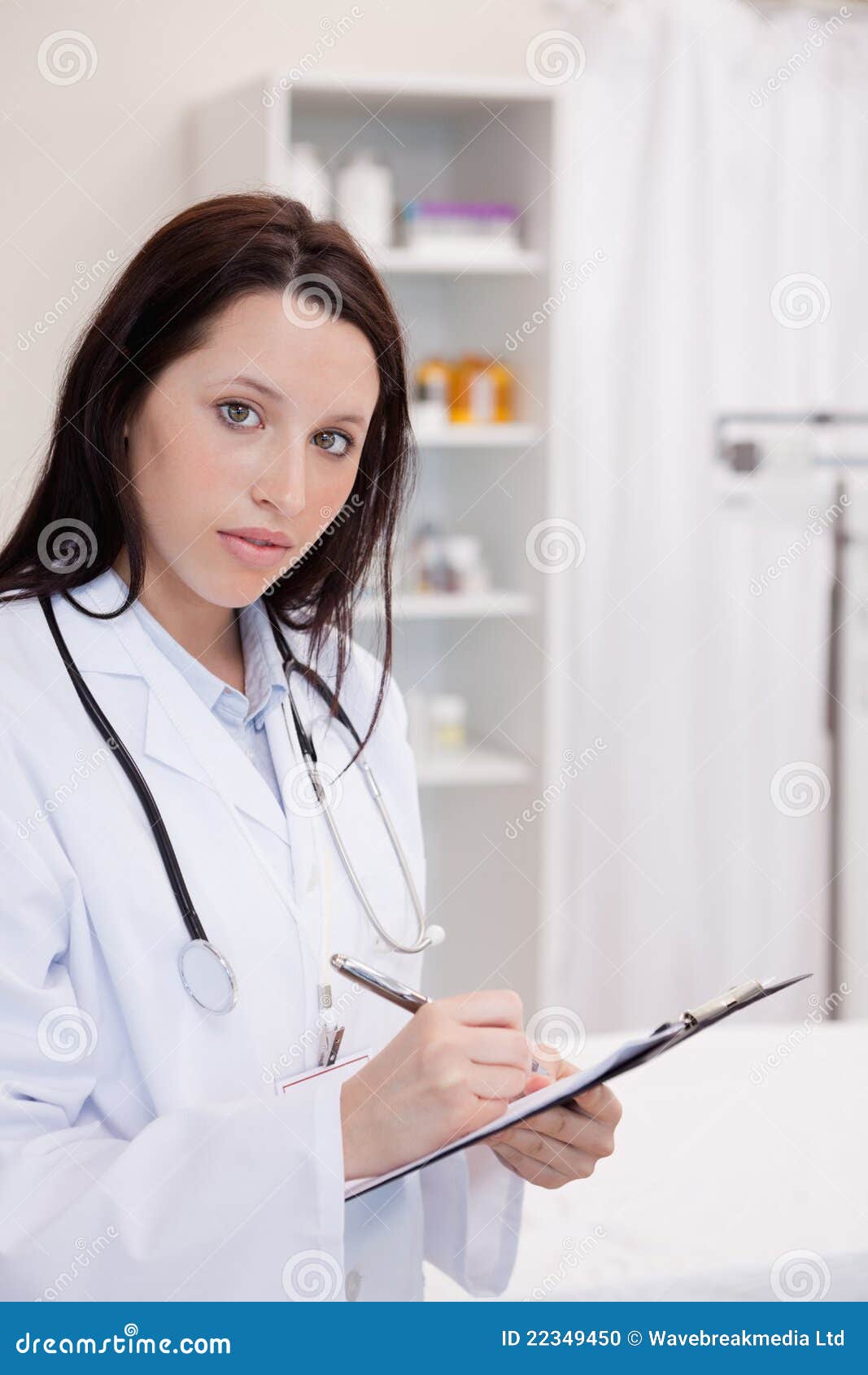 Female Doctor Writing on Her Notepad Stock Photo - Image of medic, 2024 ...