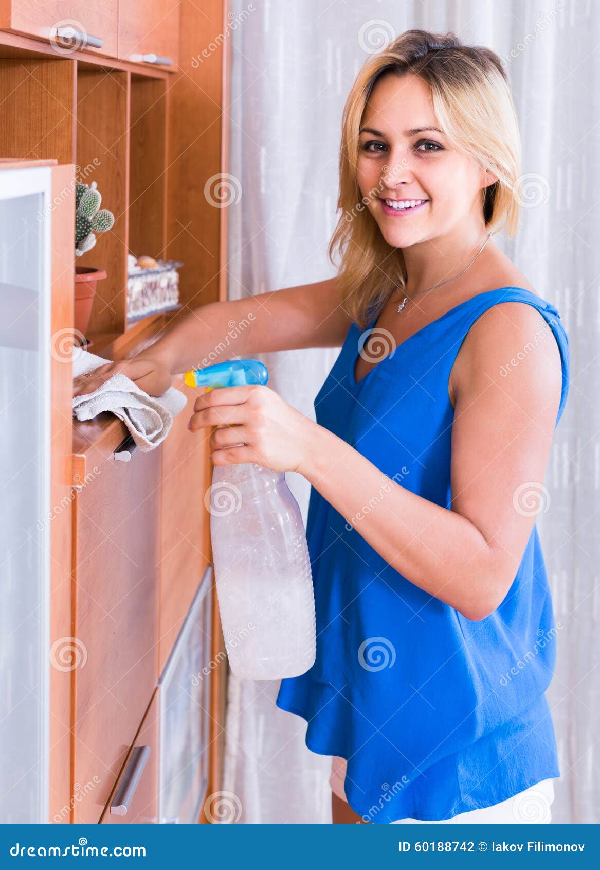 Female Doing Clean-up with Rag and Spray Stock Photo - Image of ...