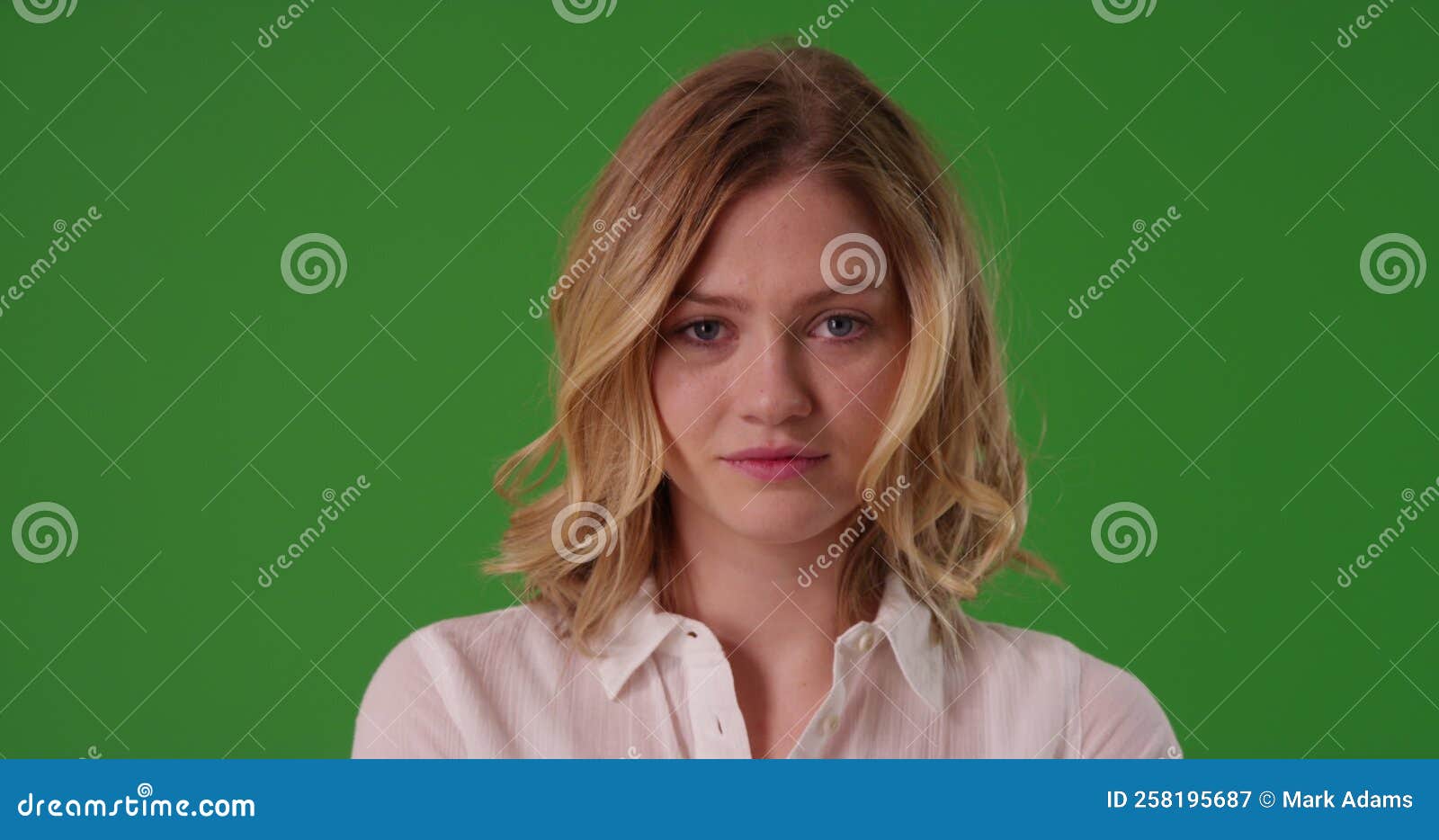 Female Dressed in White Button Down at Camera on Green Screen Stock ...