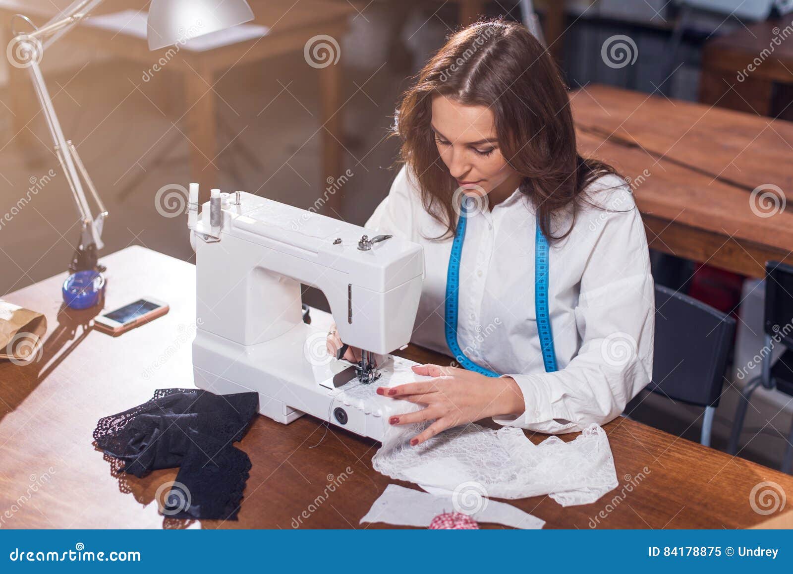 Female Dressmaker Working with Sewing Machine, Stitching Fabric Sitting ...