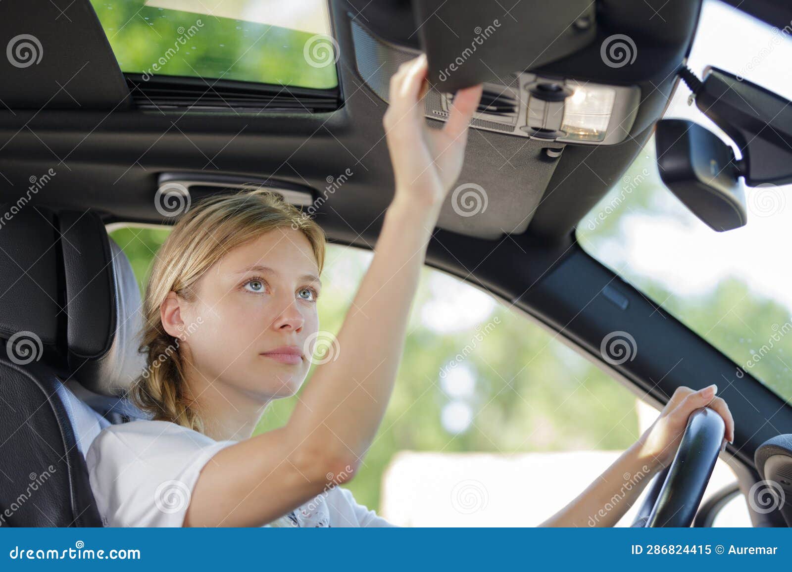 Female driver checking stock image. Image of adjust - 286824415