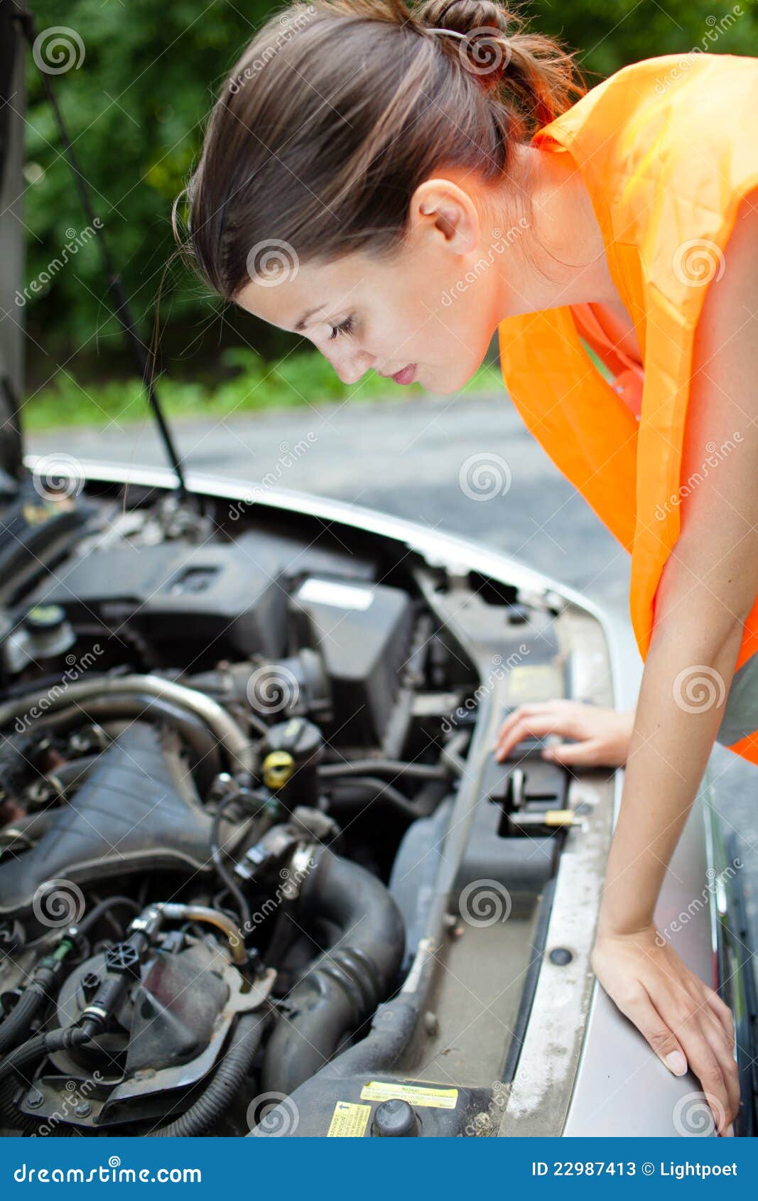 Female Driver Over the Engine of Her Broken Down C Stock Image - Image ...