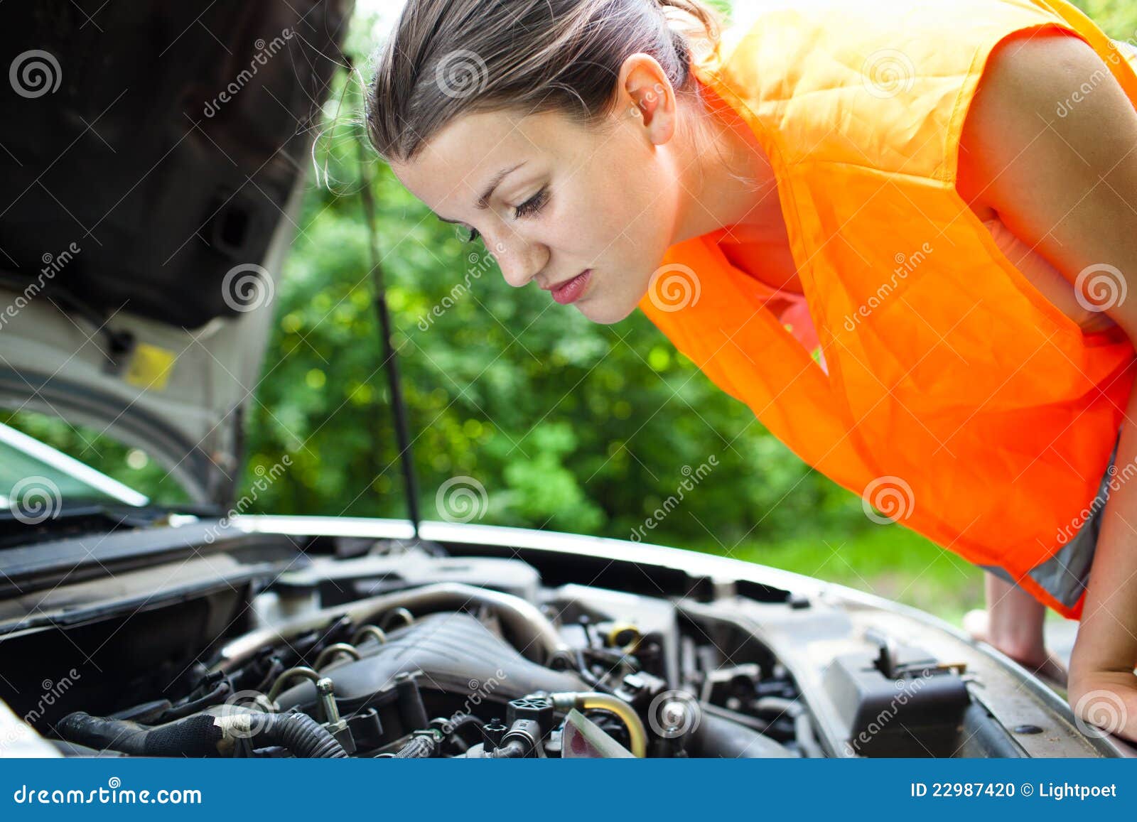 Female Driver Over the Engine of Her Broken Down C Stock Photo - Image ...