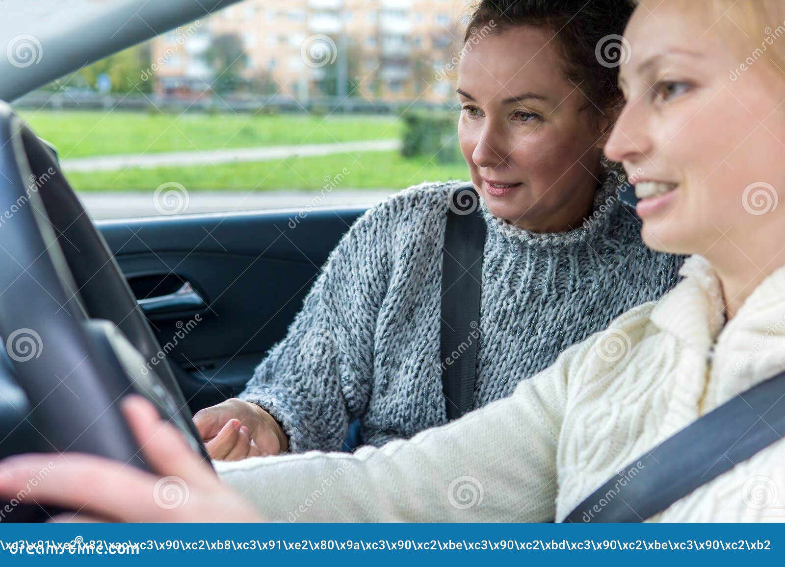Female Driving Instructor Teaches a Female Student To Drive a Car Stock ...