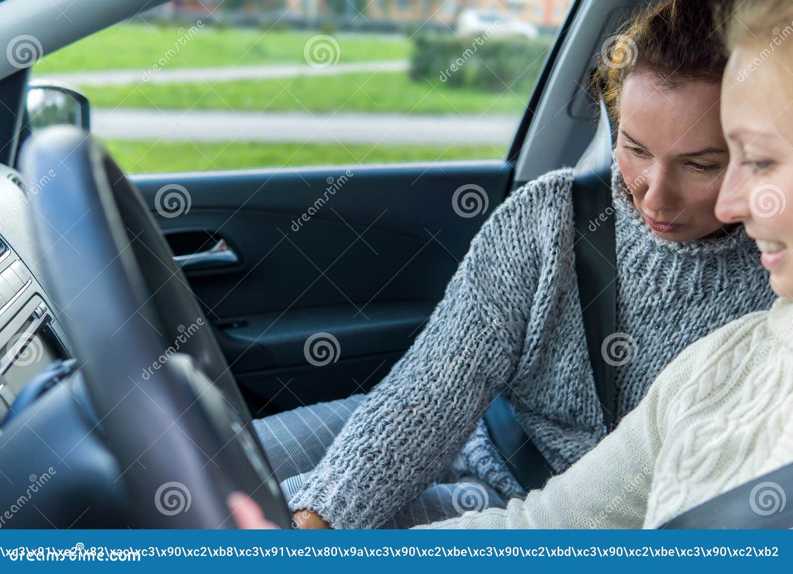 Female Driving Instructor Teaches a Female Student To Drive a Car Stock ...