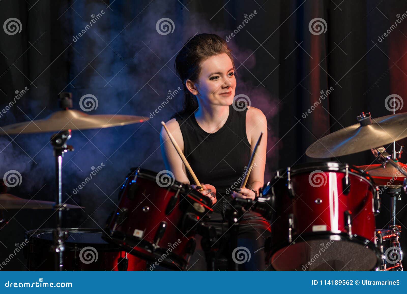 Female drummer at drumset stock photo. Image of sound - 114189562