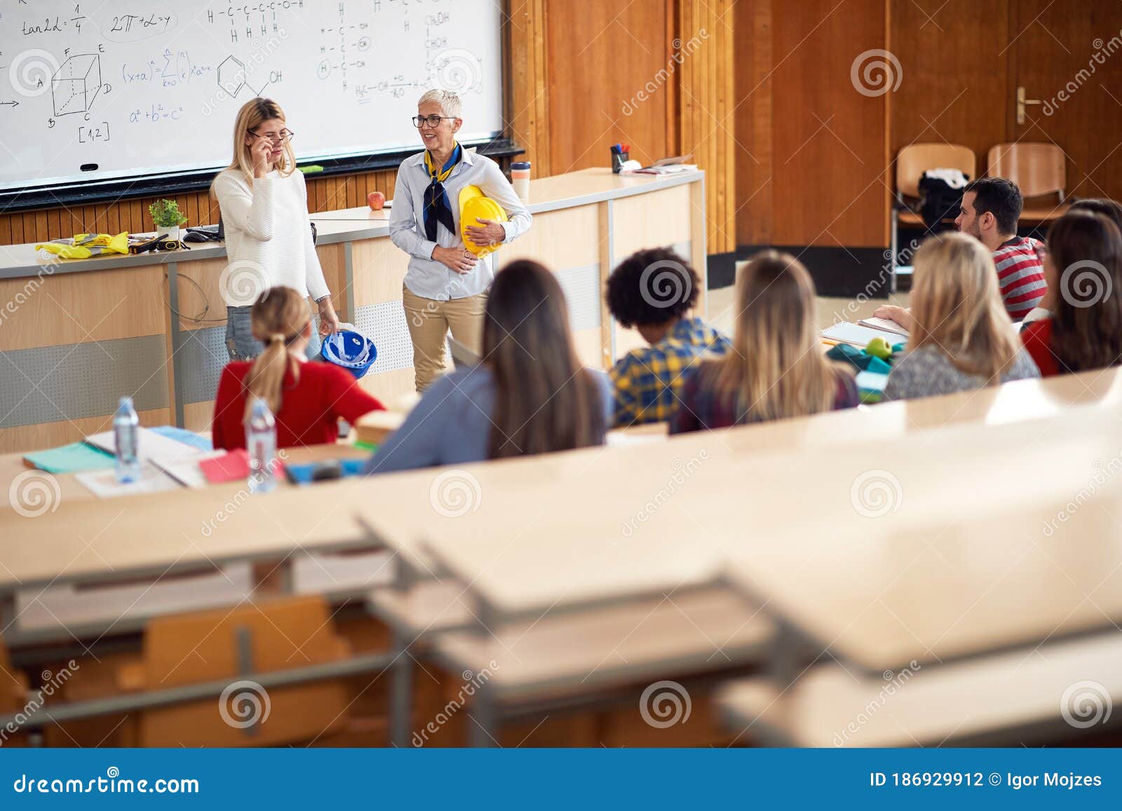 Elderly Professor Is Doing A Science Experiment In A Modern Laboratory ...