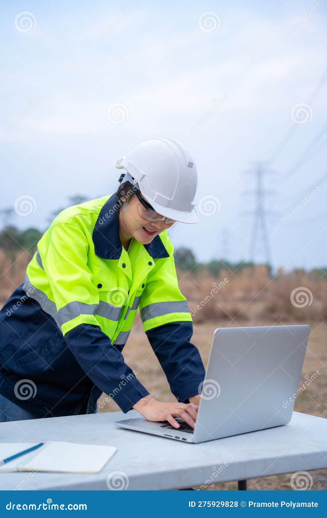A Female Electrical Engineers Checking Location Using a Notebook ...