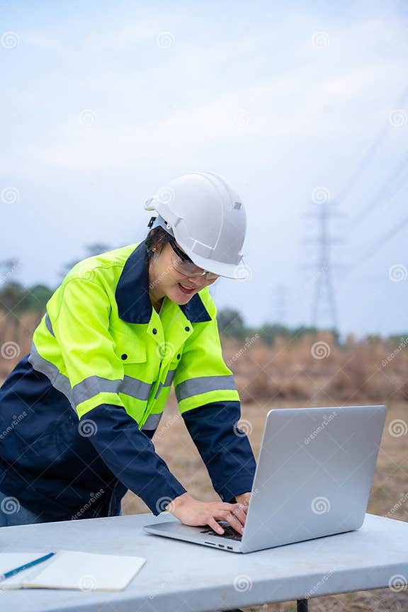 A Female Electrical Engineers Checking Location Using a Notebook ...