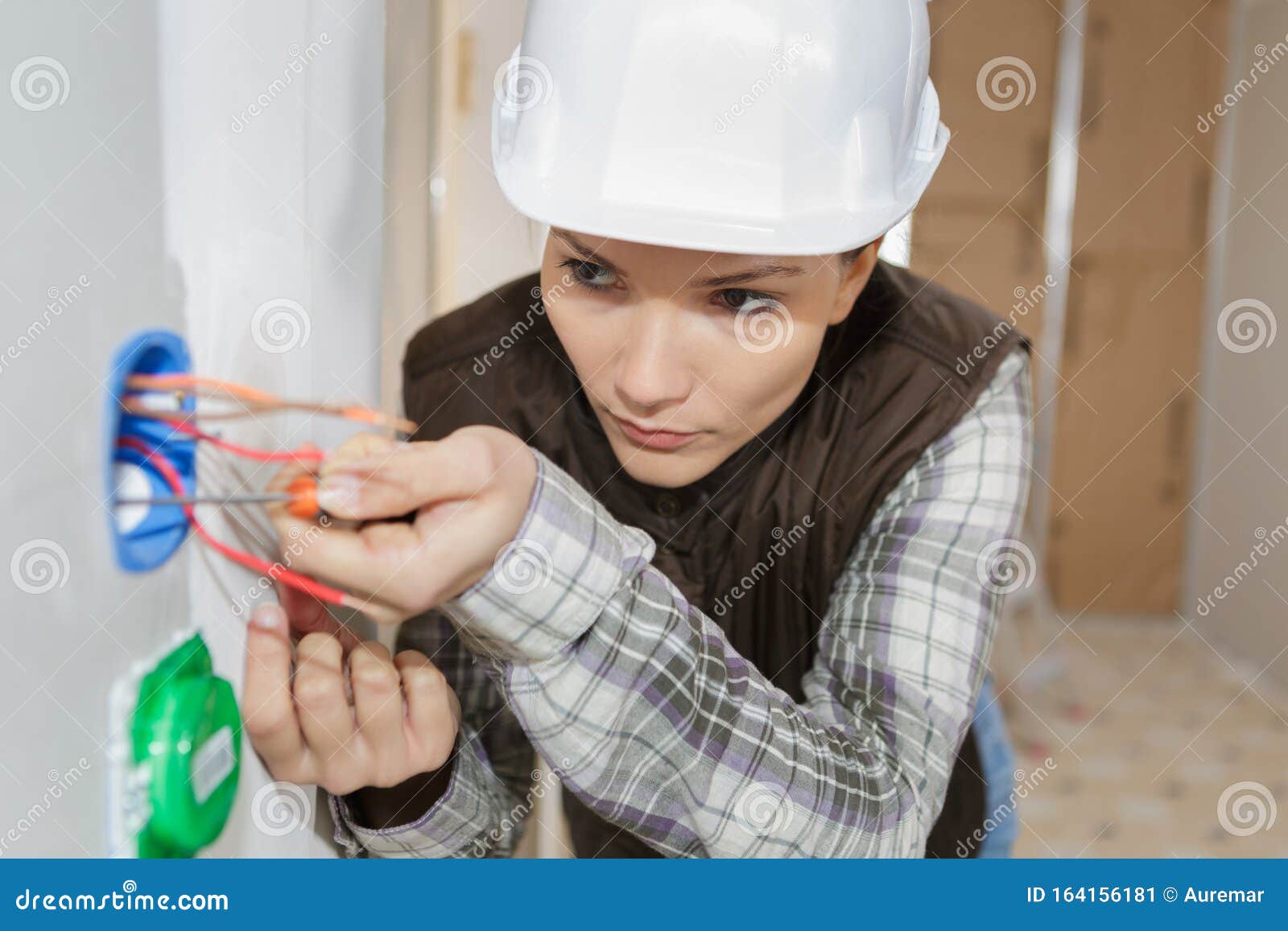 Female Electrician Fixing Electric Cables in Socket Stock Image - Image ...