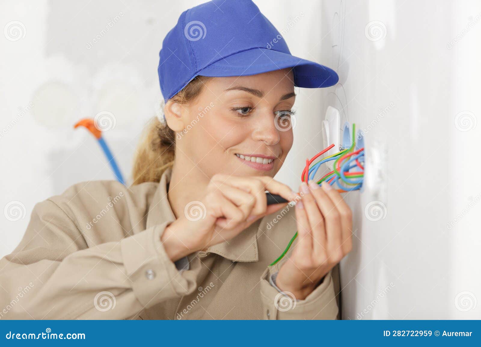 Female Electrician Fixing Electric Cables in Socket Stock Image - Image ...