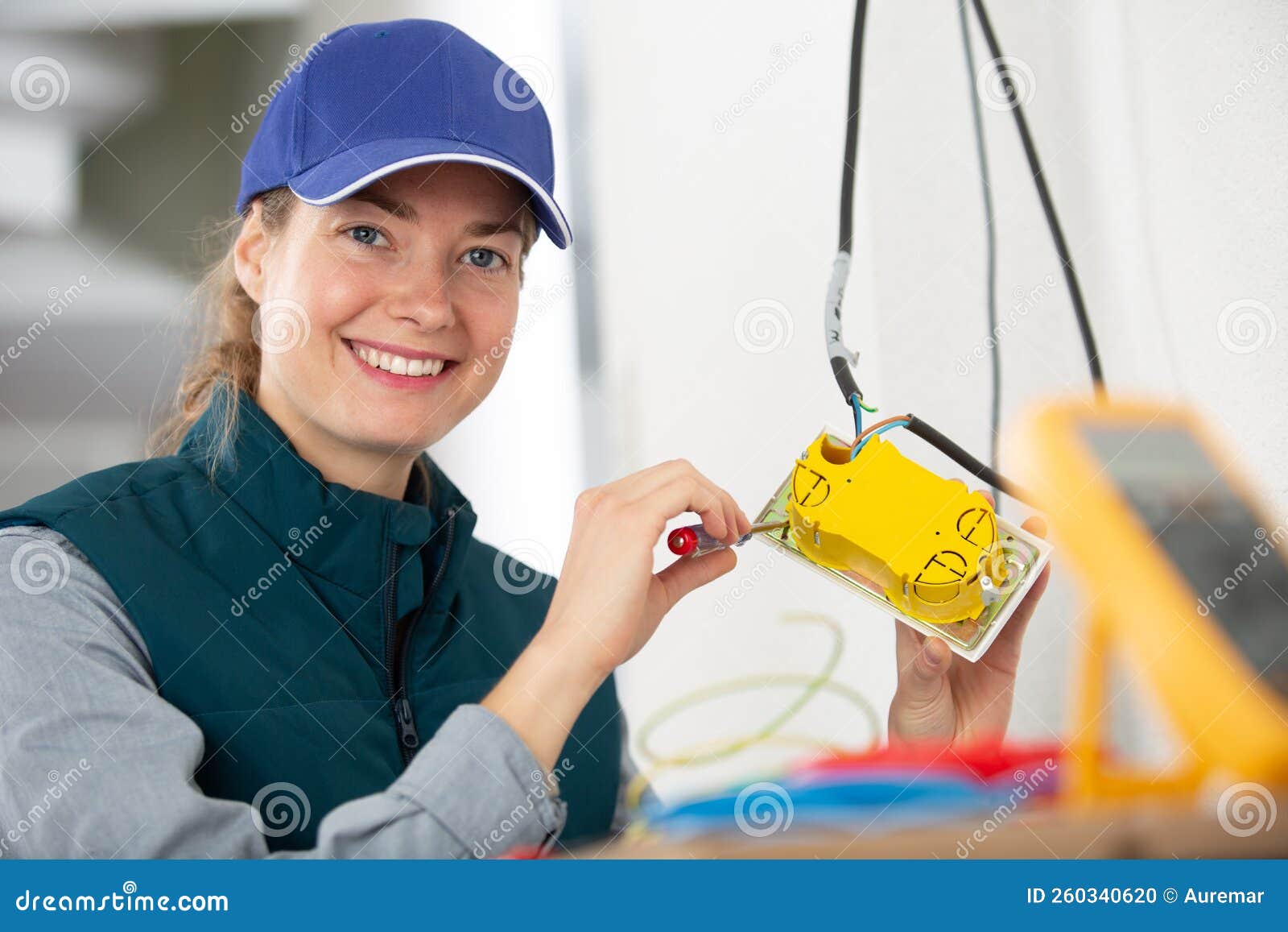 Female Electrician Happy at Work Stock Photo - Image of female, wall ...
