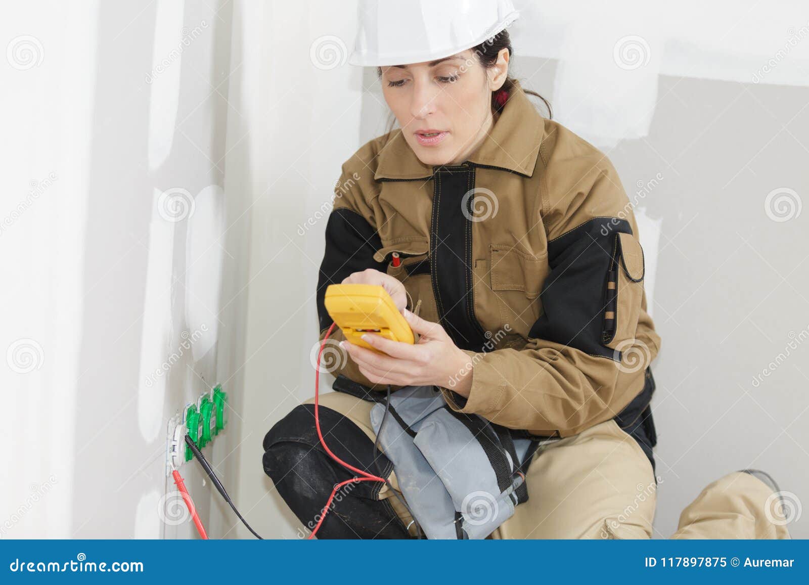 Female Electrician Installing Electrical Socket on Wall Stock Image ...