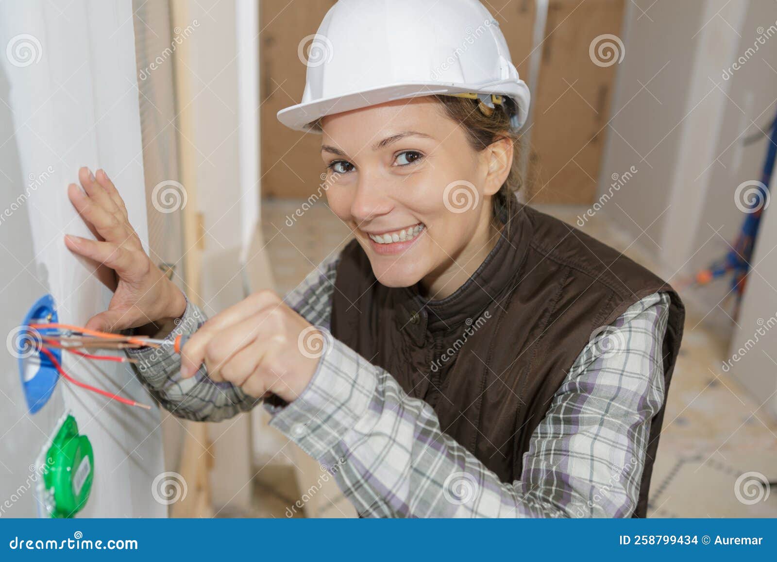 Female Electrician Installing Wall Socket Stock Photo - Image of ...