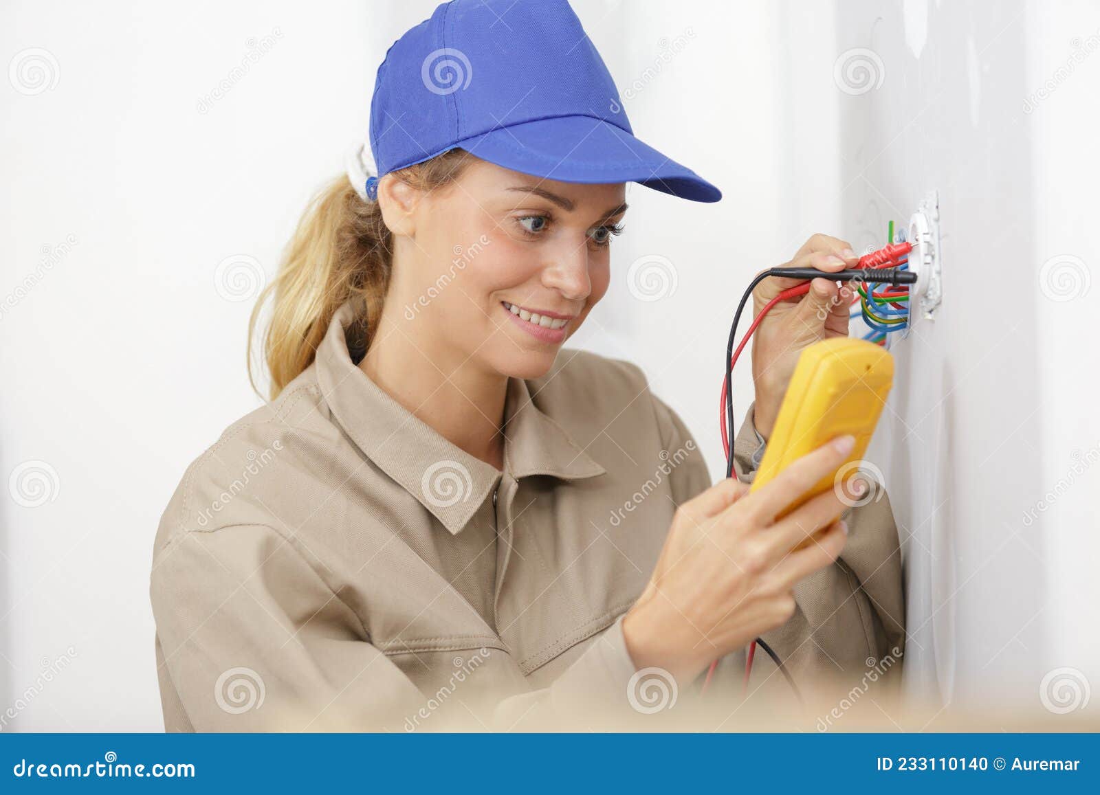 Female Electrician Testing Socket Using Multimeter Stock Photo - Image ...
