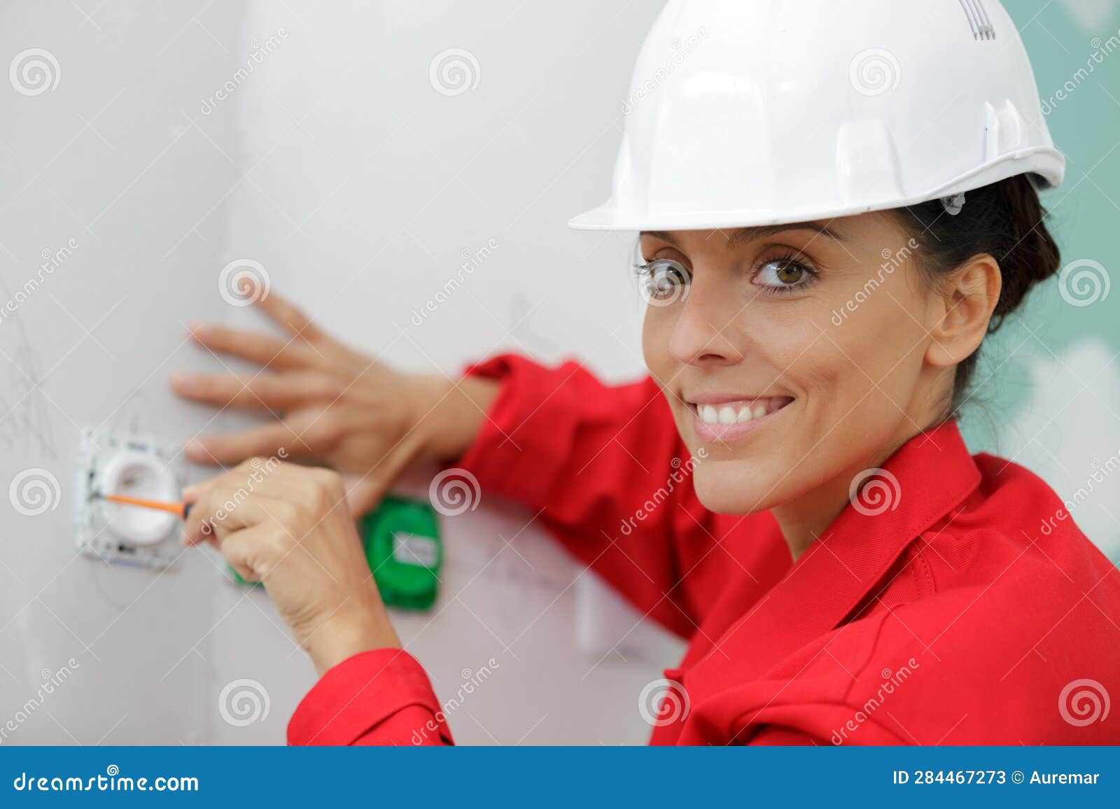 Female Electrician Testing Wall Socket Stock Image - Image of safety ...