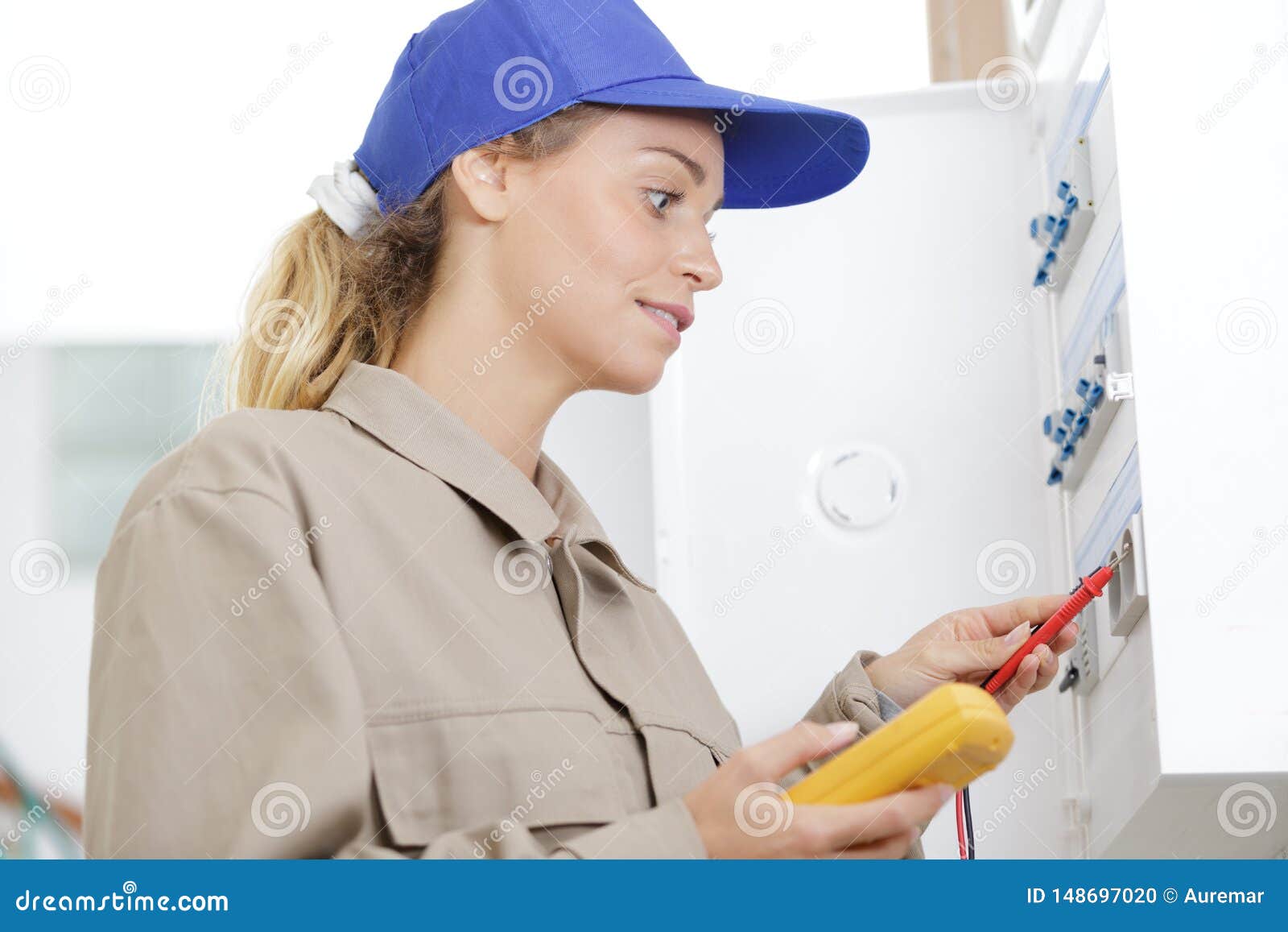 Female Electrician Using Multimeter on Circuit Breaker Cabinet Stock ...