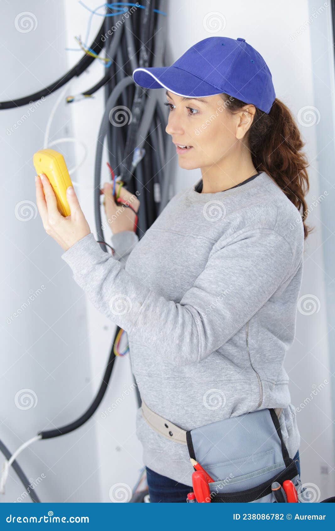 Female Electrician Using Multimeter Stock Photo - Image of control ...