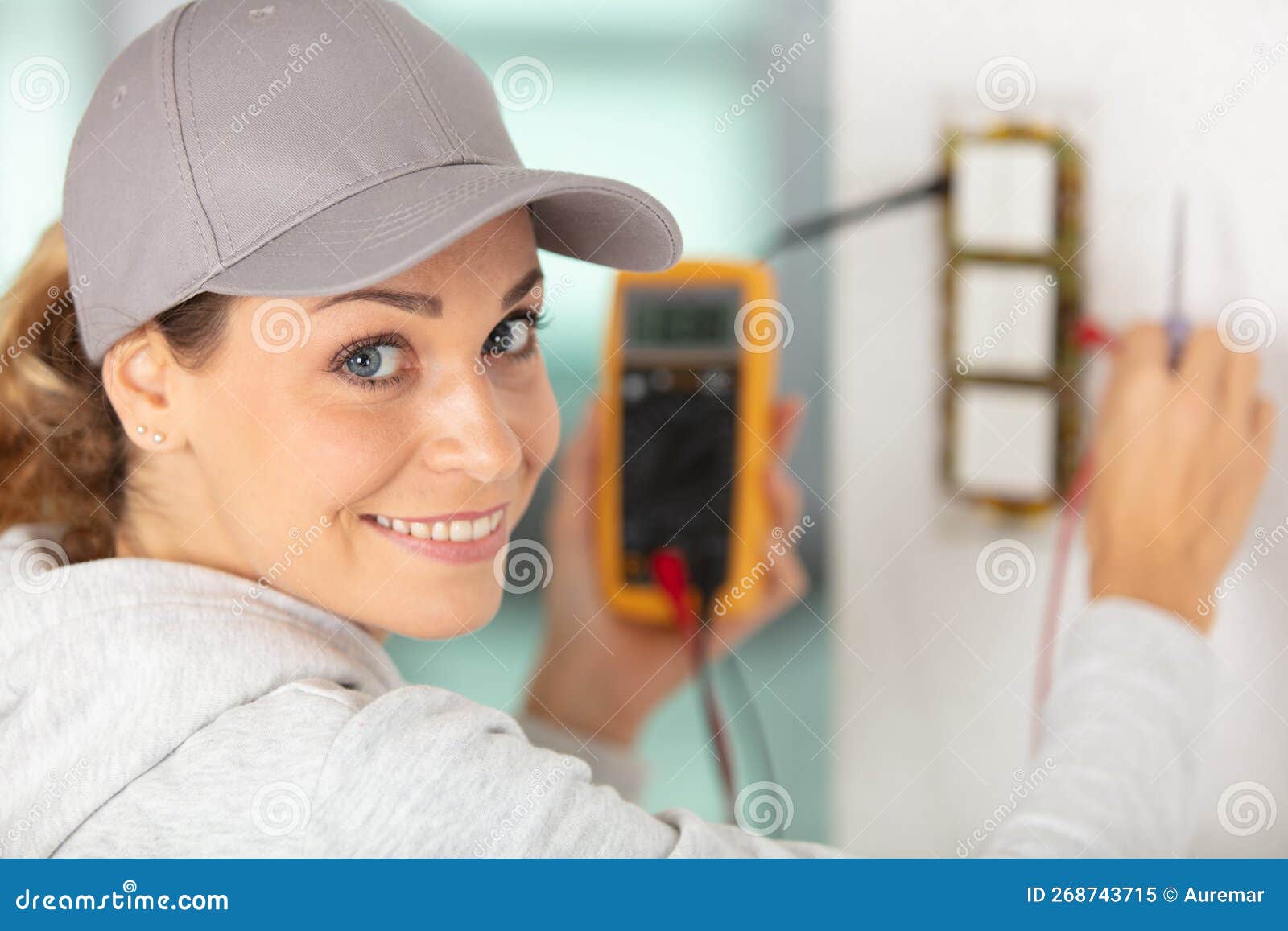 Female Electrician Using Multimeter on Switches Stock Image - Image of ...