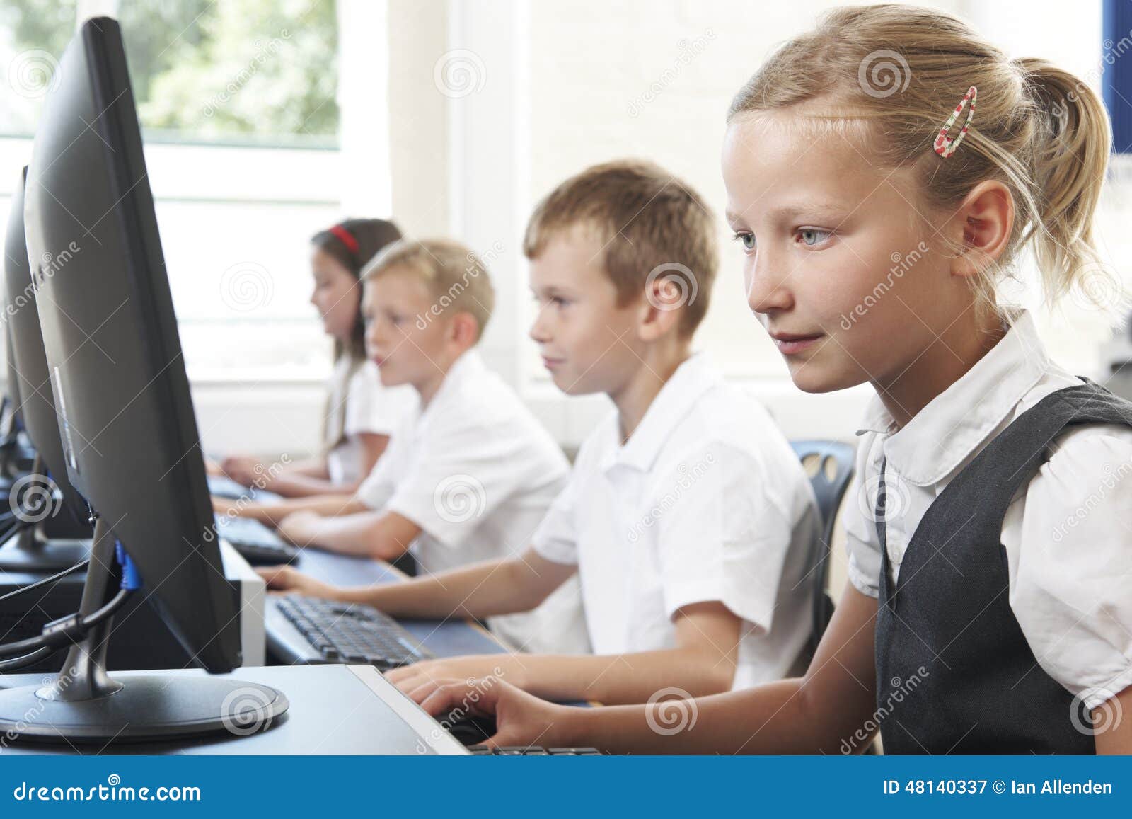 Female Elementary Pupil in Computer Class Stock Image - Image of class ...
