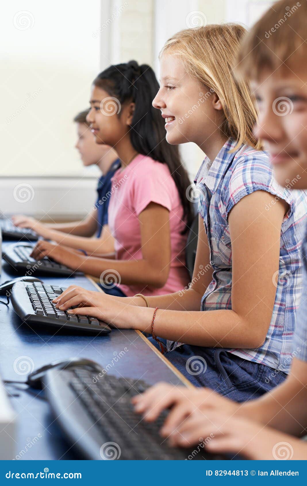 Female Elementary Pupil in Computer Class Stock Image - Image of ...
