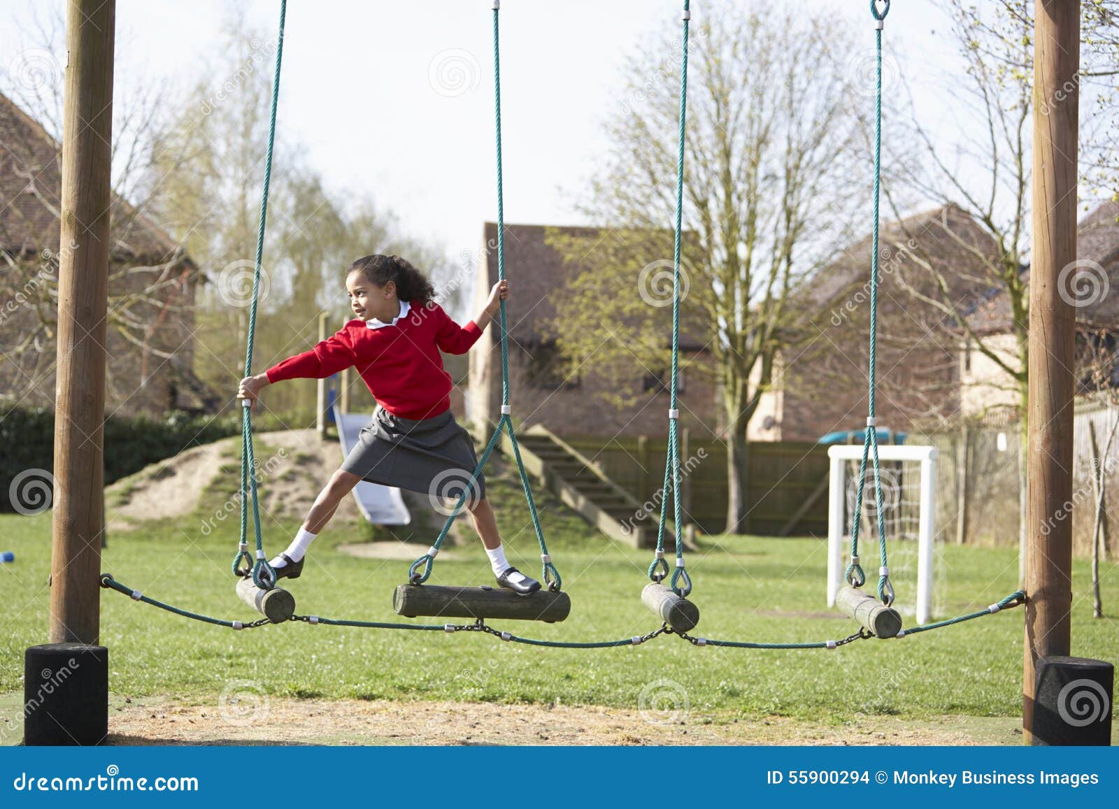 Female Elementary School Pupil on Climbing Equipment Stock Photo ...