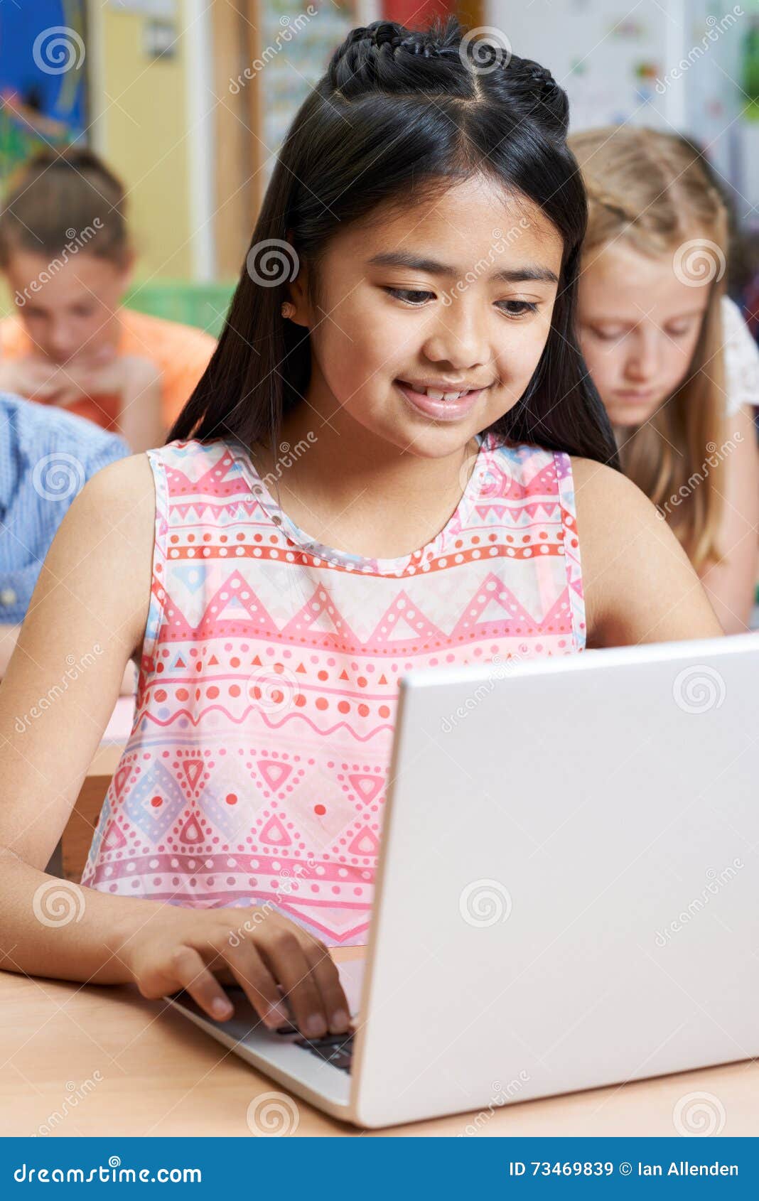 Female Elementary School Pupil Using Laptop in Computer Class Stock ...