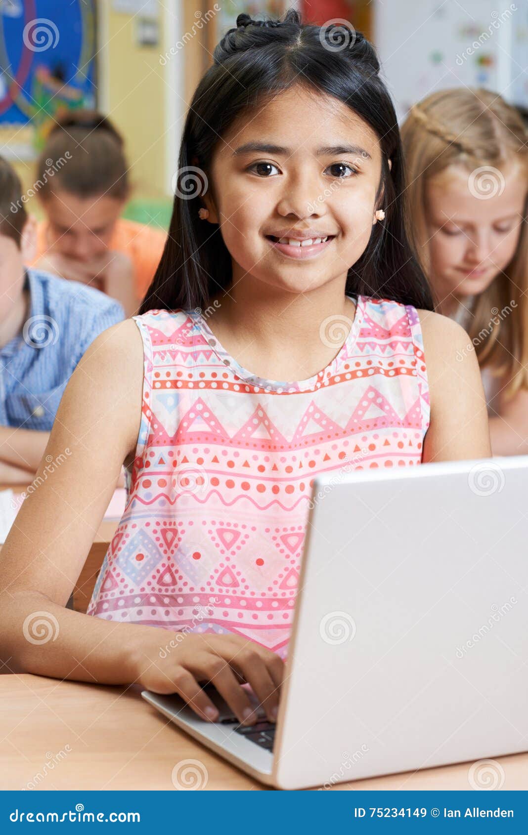 Female Elementary School Pupil Using Laptop in Computer Class Stock ...