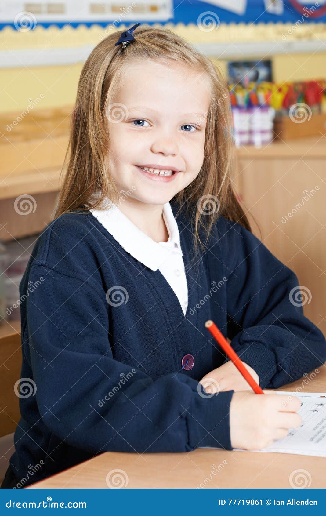 Female Elementary School Pupil Working at Desk Stock Image - Image of ...