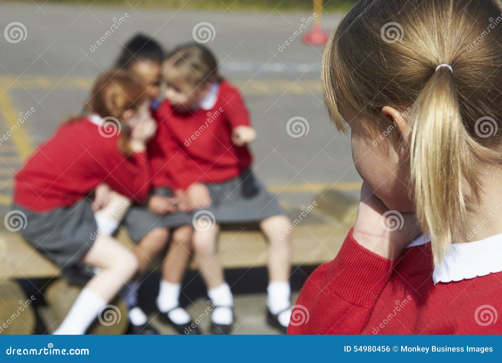 Female Elementary School Pupils Whispering in Playground Stock Photo ...