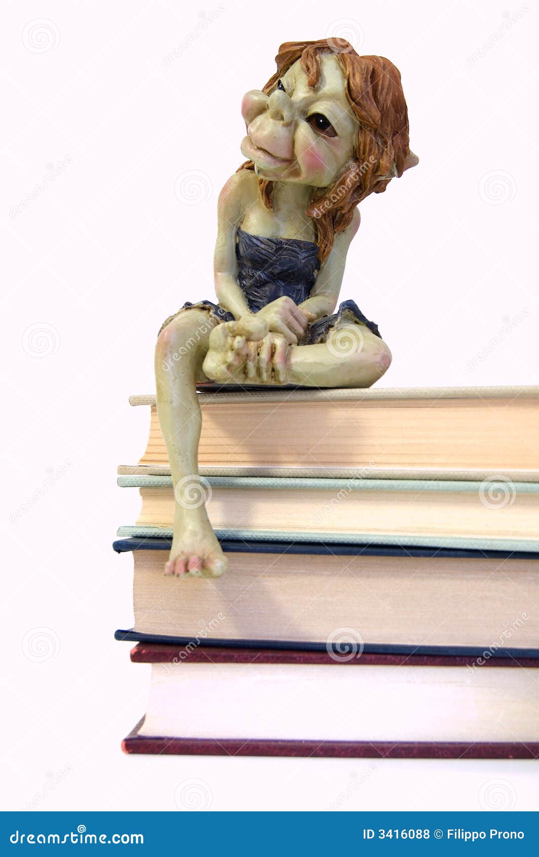 Female elf on books stock photo. Image of piled, knickknack - 3416088