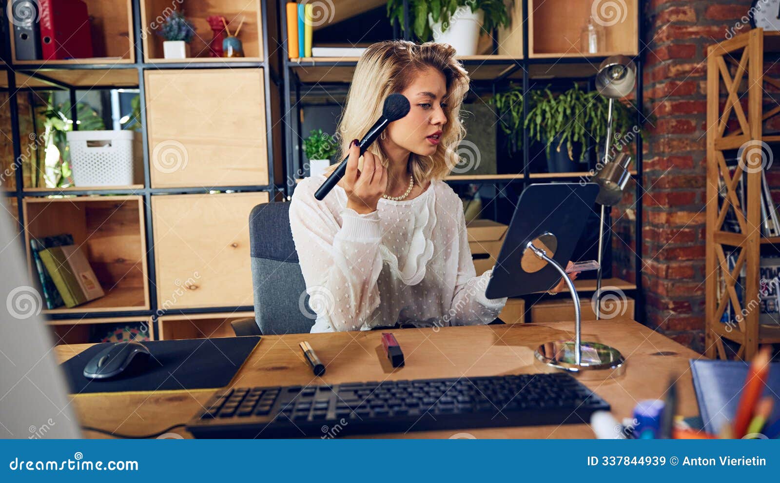 Female Employee Applies Makeup at Her Desk. she& X27;s Distracted from ...