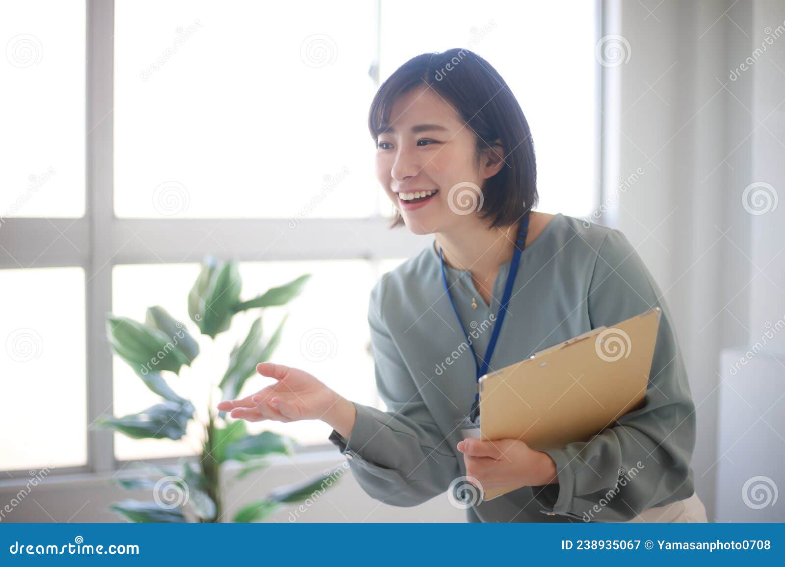 Female Employee with a Binder Stock Image - Image of finger, hair ...