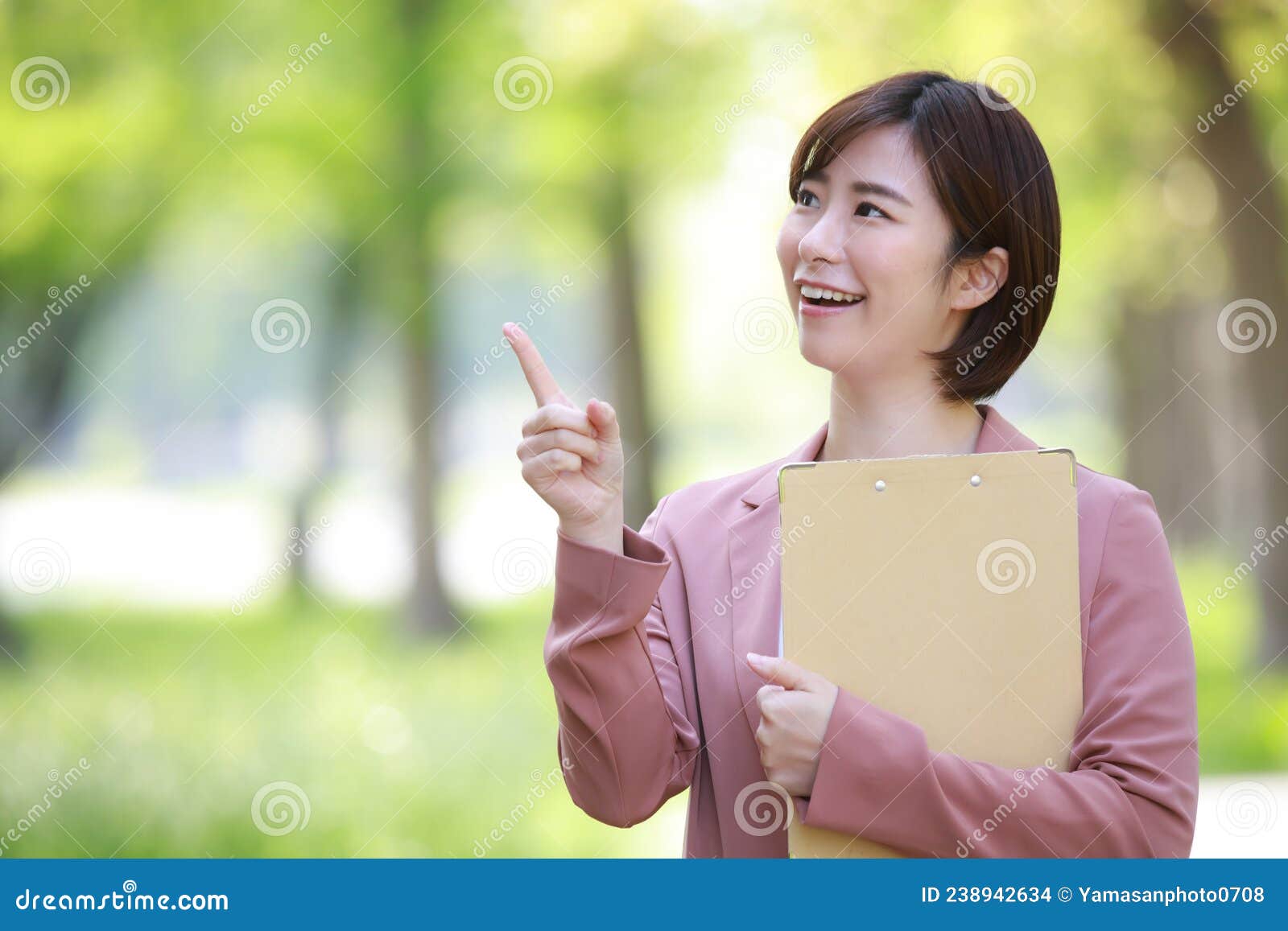 Female Employee with a Binder Stock Photo - Image of photograph, pink ...