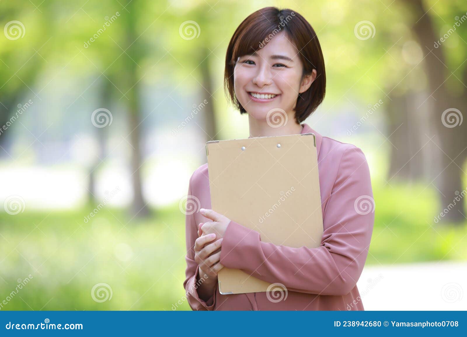 Female Employee with a Binder Stock Photo - Image of clothing, person ...