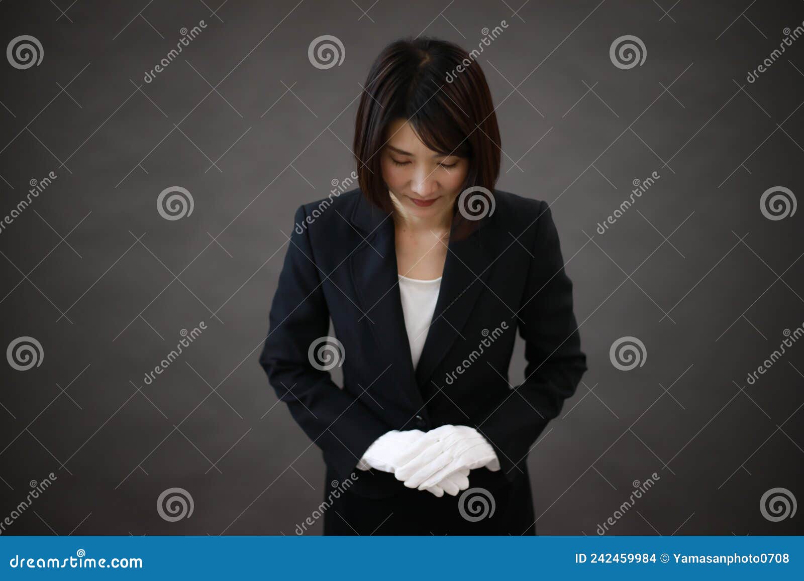 Female employee bowing stock photo. Image of courtesy - 242459984