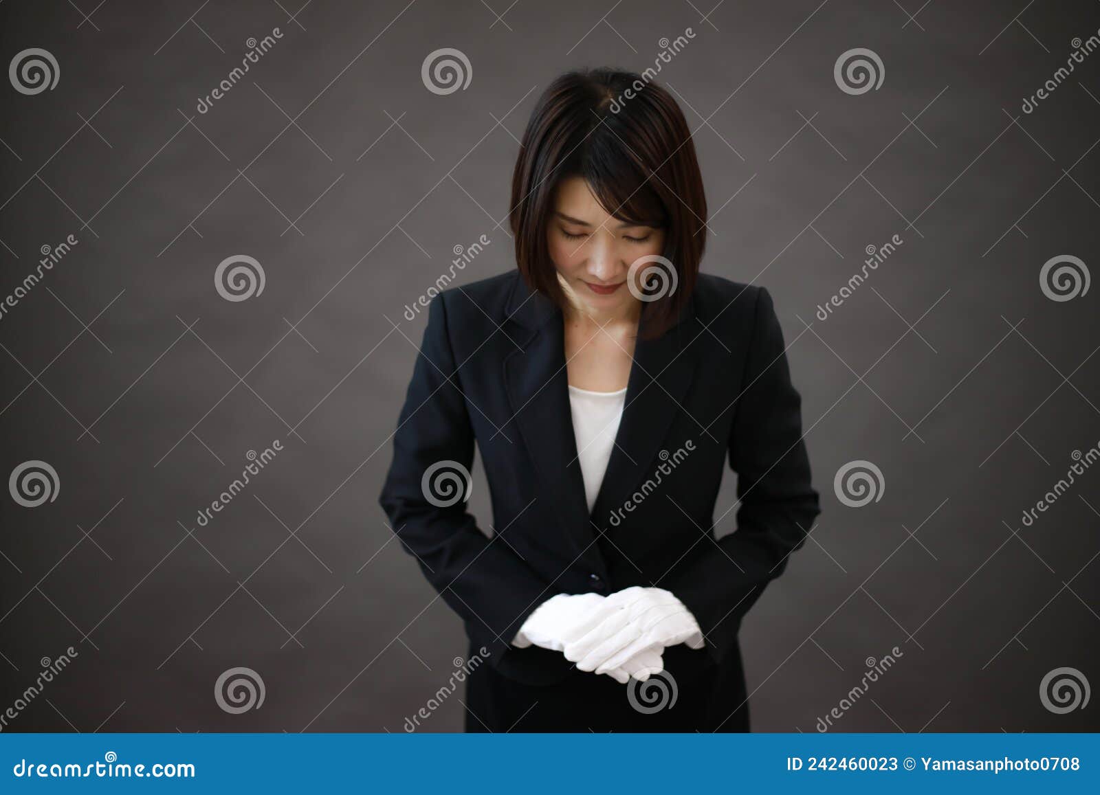 Female employee bowing stock image. Image of manners - 242460023
