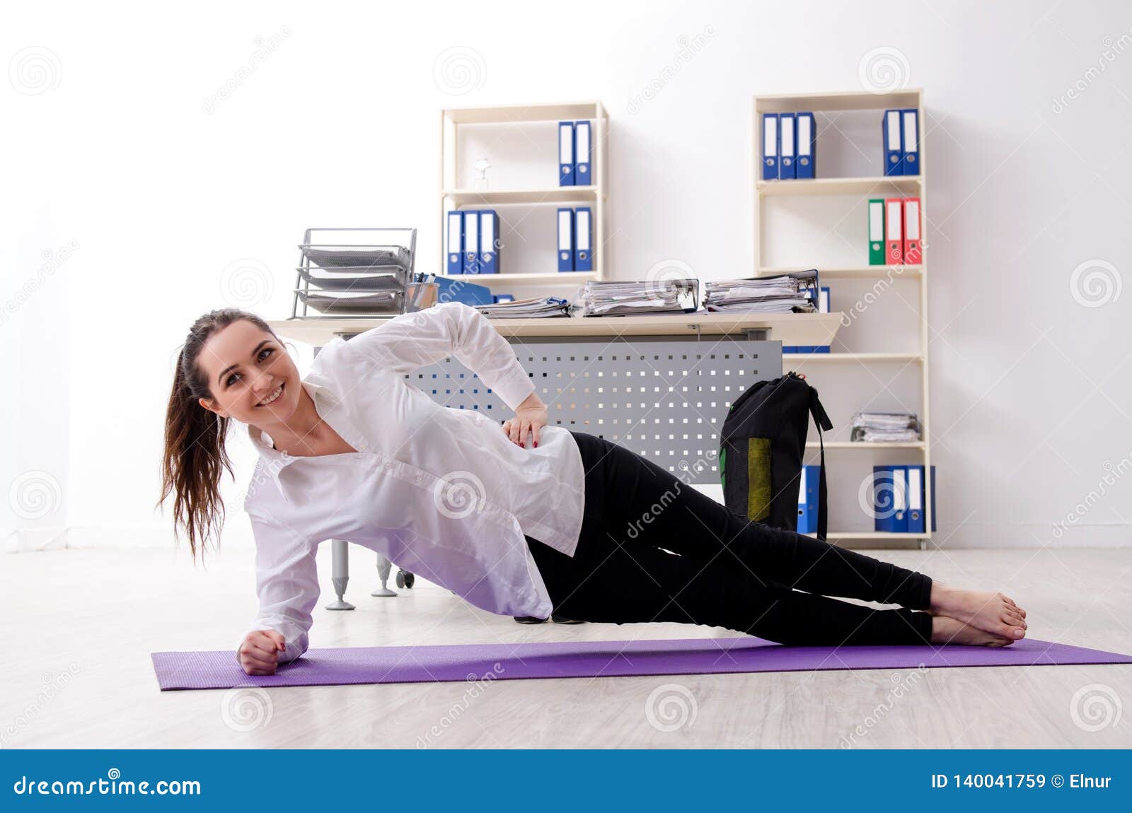 The Female Employee Doing Sport Exercises in the Office Stock Image ...