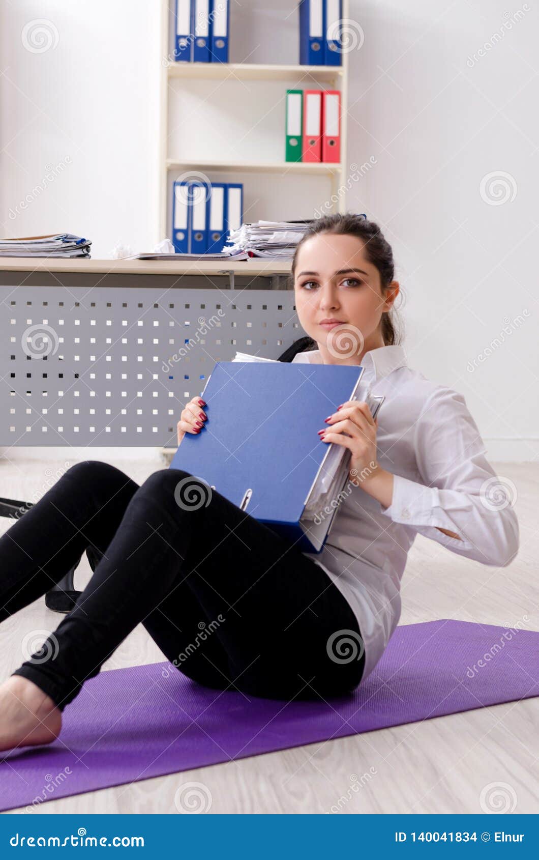 The Female Employee Doing Sport Exercises in the Office Stock Photo ...