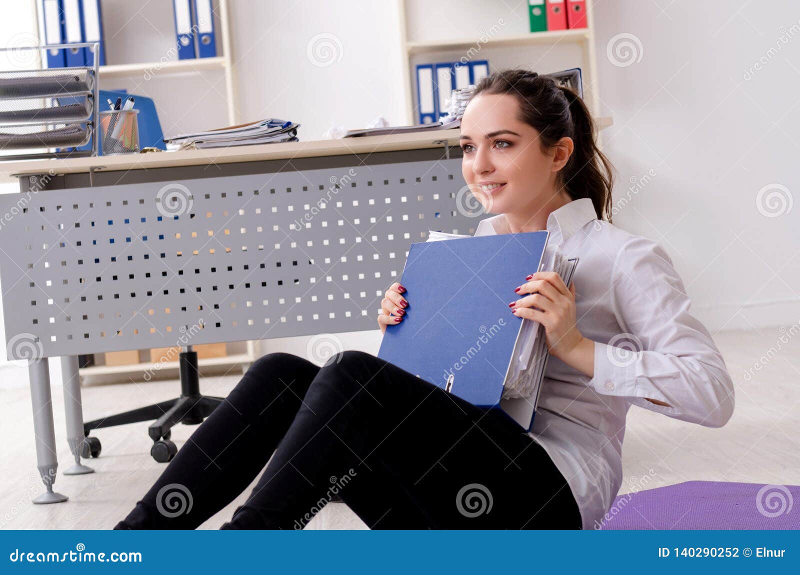 The Female Employee Doing Sport Exercises in the Office Stock Photo ...