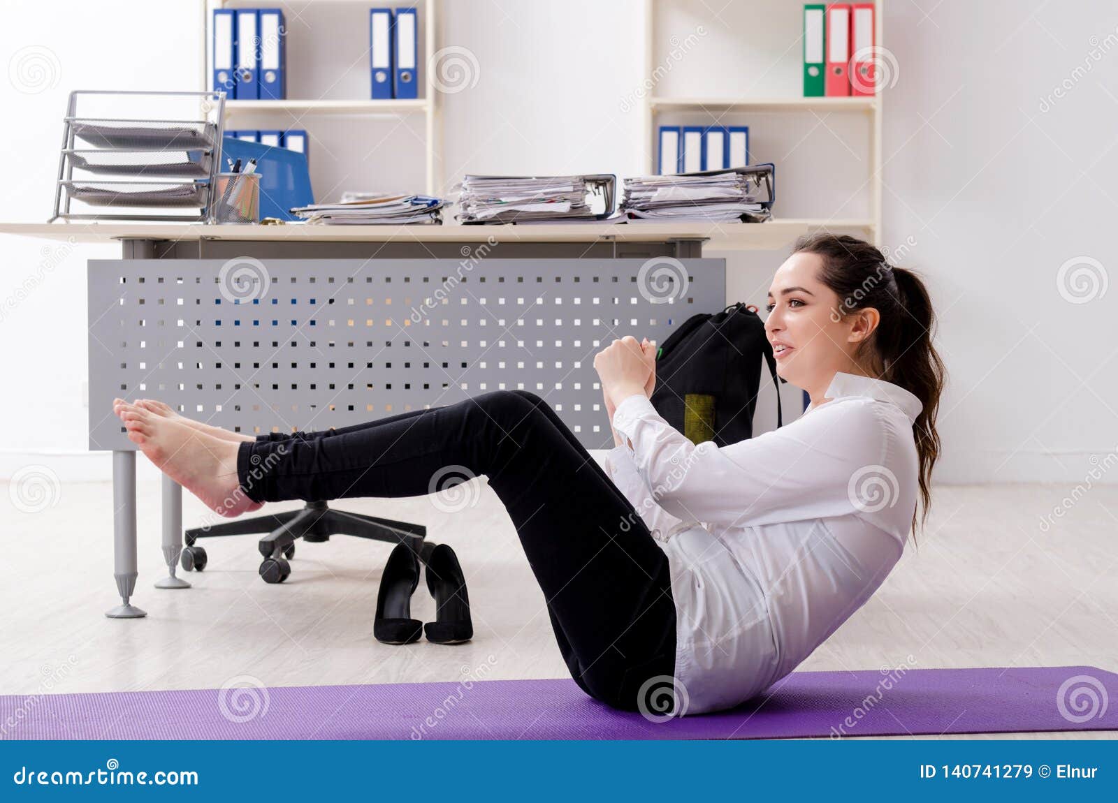 The Female Employee Doing Sport Exercises in the Office Stock Image ...