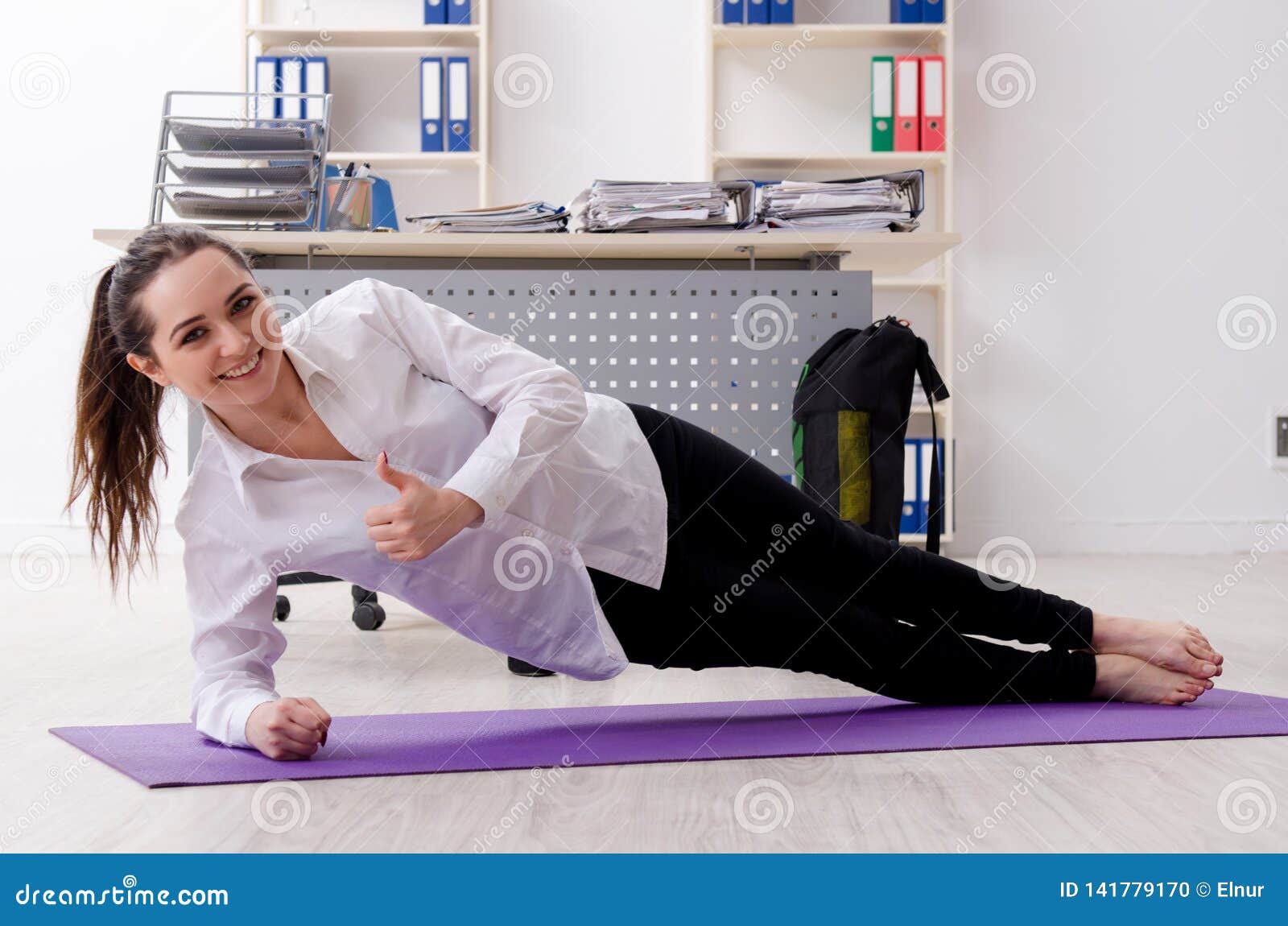 The Female Employee Doing Sport Exercises in the Office Stock Photo ...