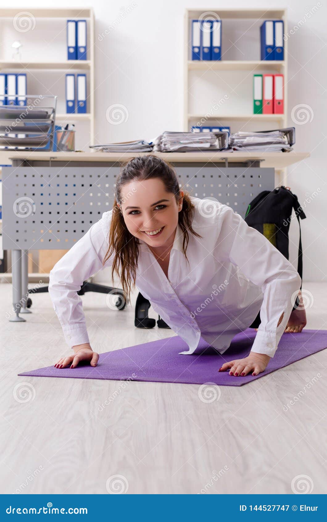 The Female Employee Doing Sport Exercises in the Office Stock Image ...