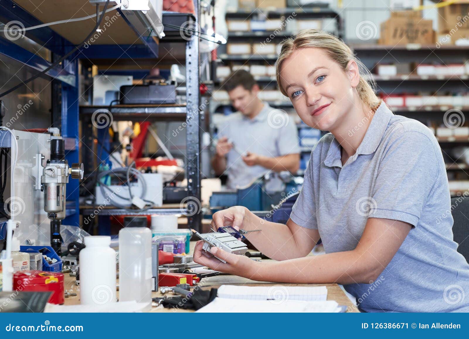 Portrait of Female Engineer in Factory Measuring Component at Work ...