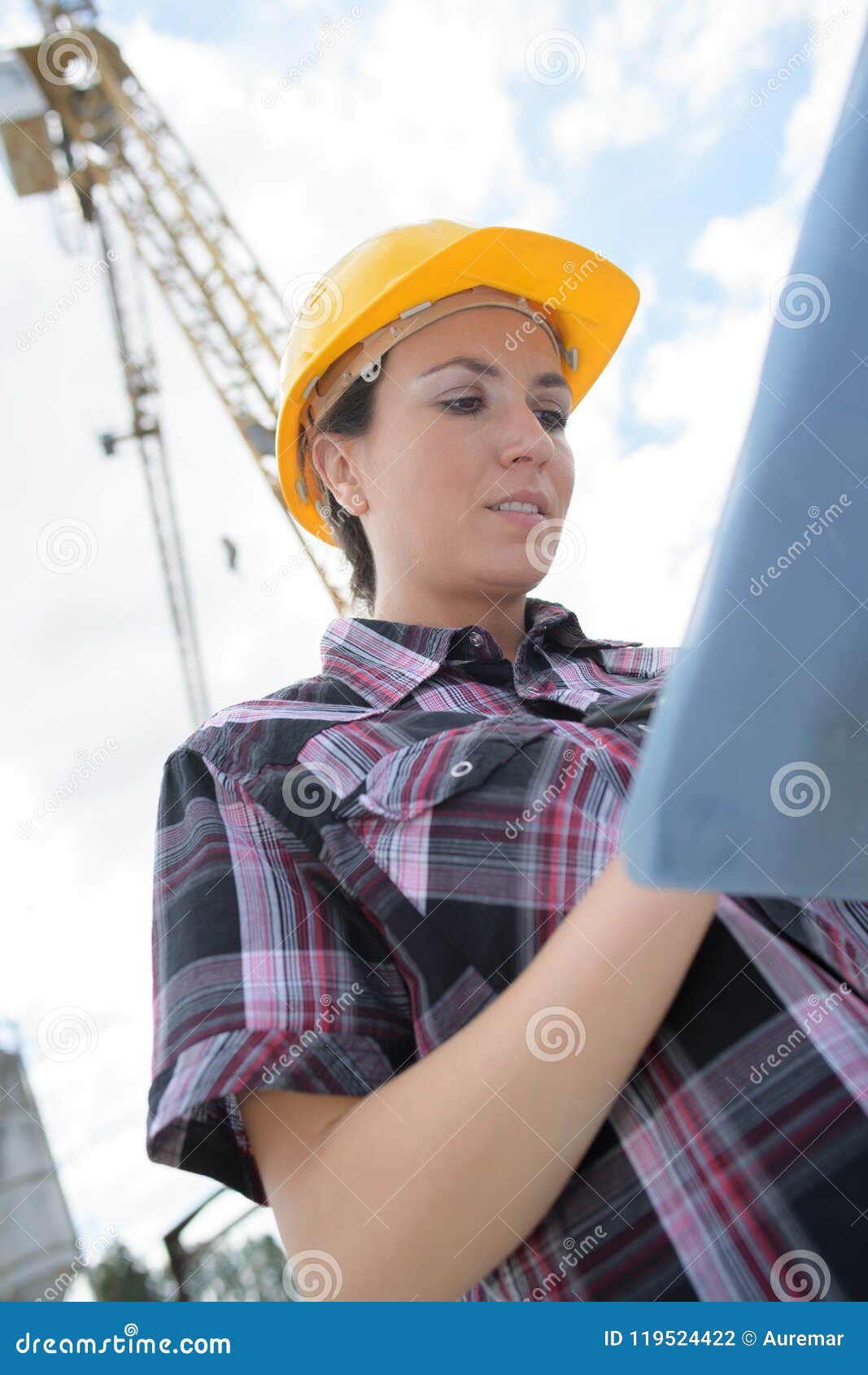 Female Engineer Holding Construction Plans Stock Photo - Image of ...