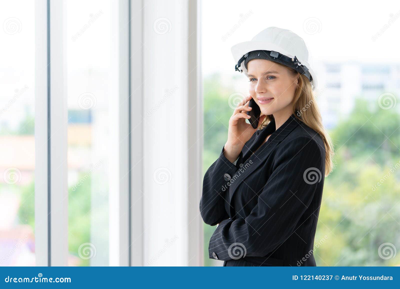 Female Engineer Making Call in Office Building Stock Image - Image of ...