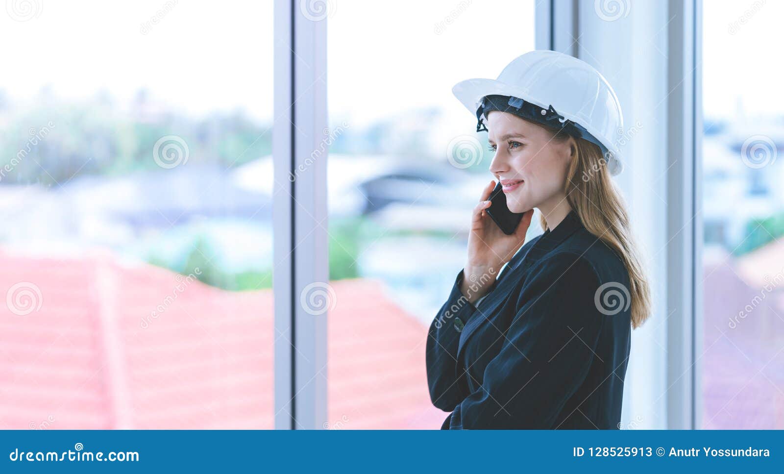Female Engineer Making Call in Office Building Stock Image - Image of ...